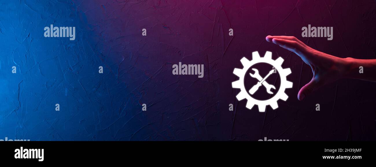 Businessman holding gear icon with tools.Gearing.Concept of target ...