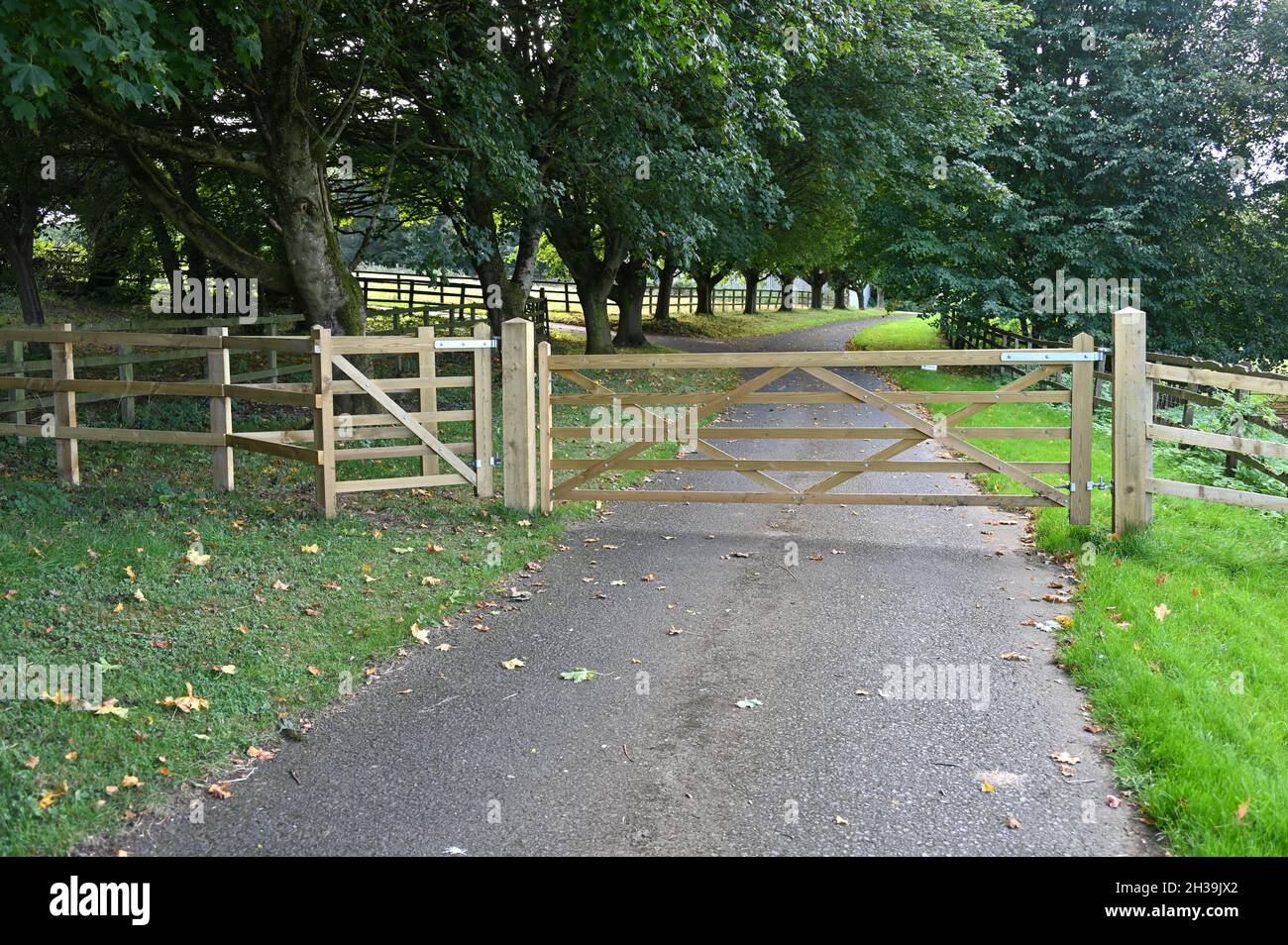 A five bar gate with a kissing gate for pedestrians at the side lies ...