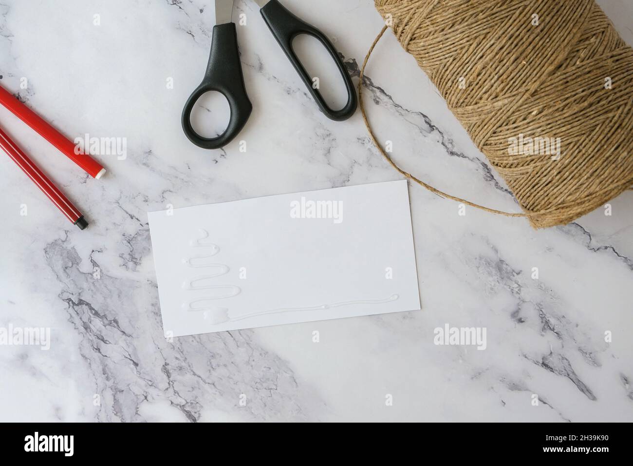 Christmas tree made of rope. Top view of hands making step by step DIY ...