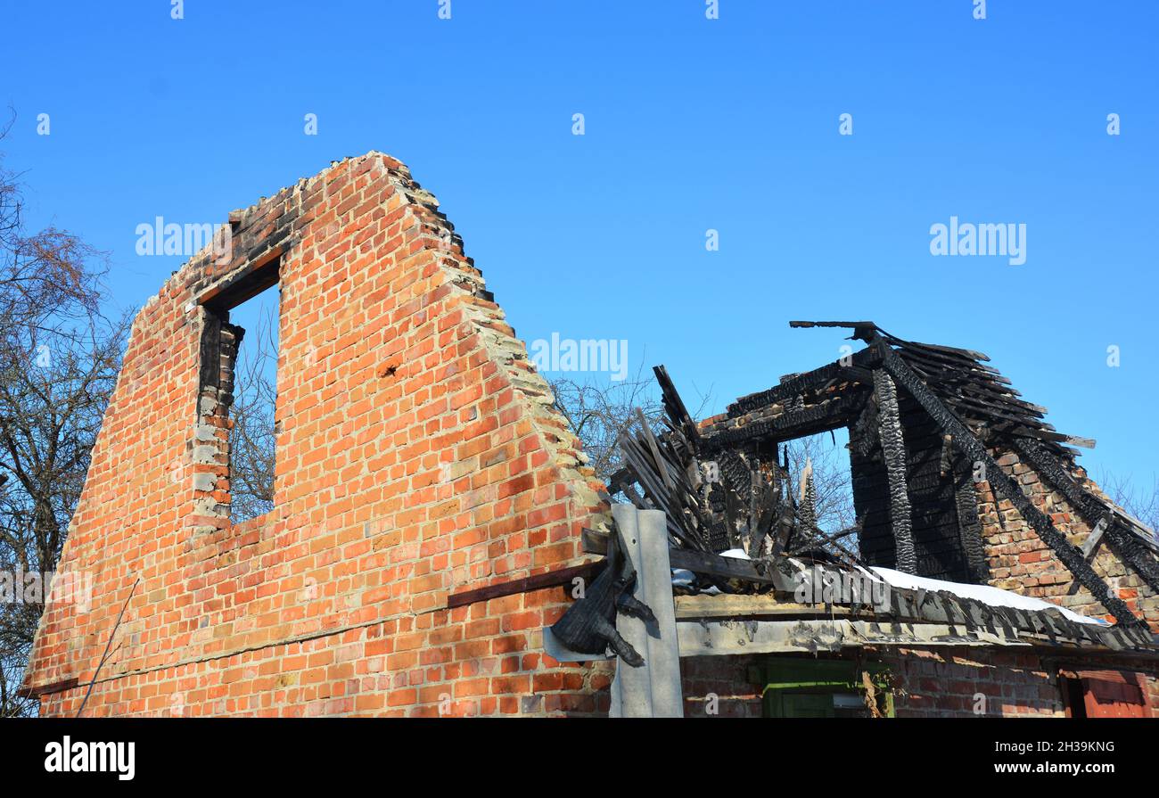Old Home Burns Down in Winter. Brick House Roof Fire Damage Stock Photo ...