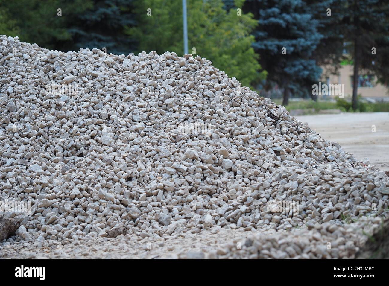 Construction site, landscaping. A pile of small stones, pebbles at a ...