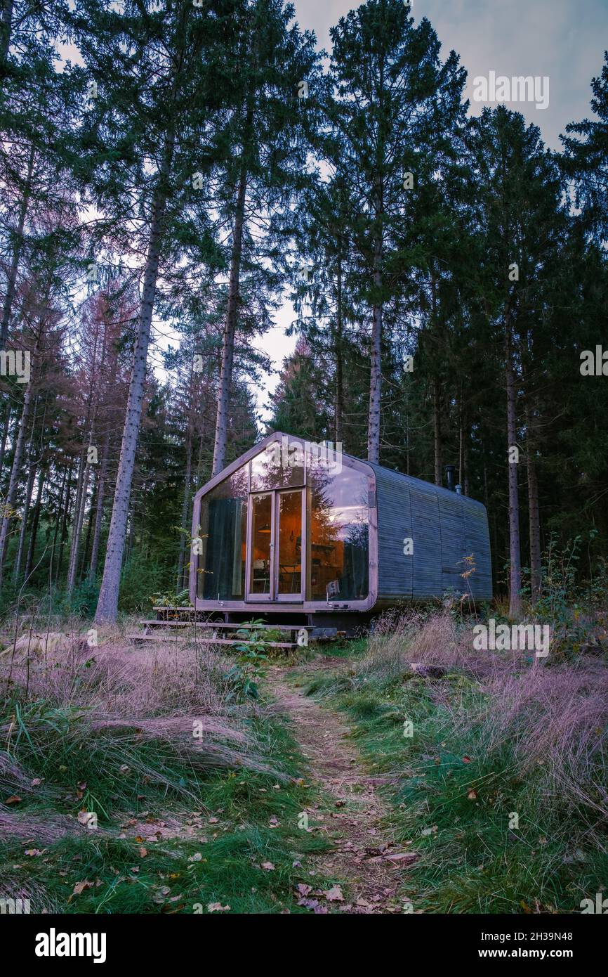 Wooden hut in an autumn forest in the Netherlands, cabin off grid ...