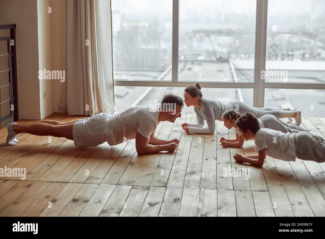 All family doing plank together at home Stock Photo - Alamy