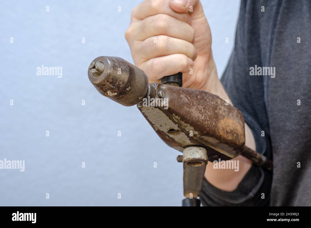 Vintage hand drill in man hand hi-res stock photography and images - Alamy