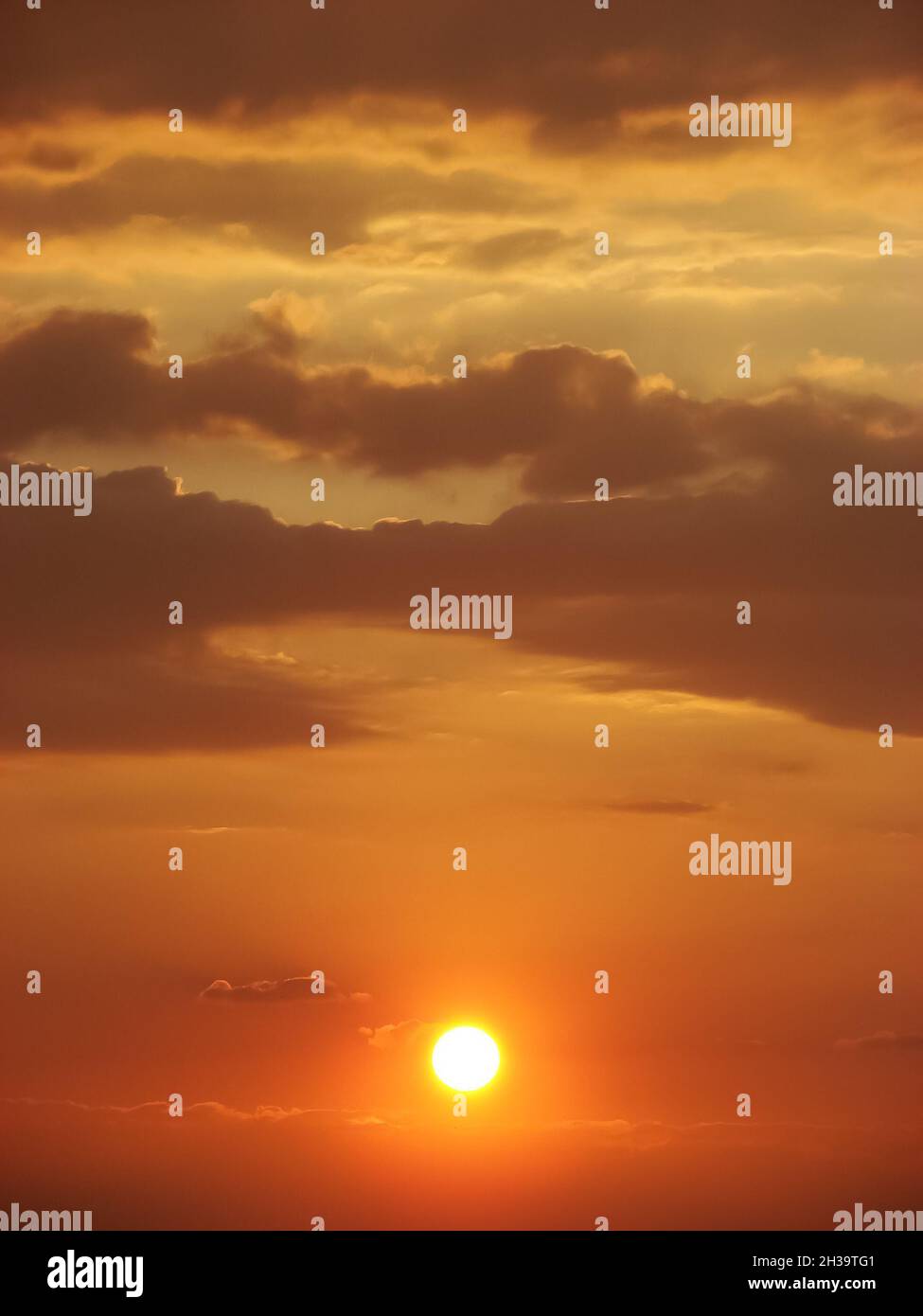 Sun surrounded by clouds hi-res stock photography and images - Alamy