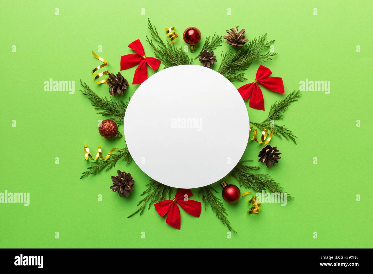 Flat lay Christmas composition. Round Paper blank, pine tree branches ...