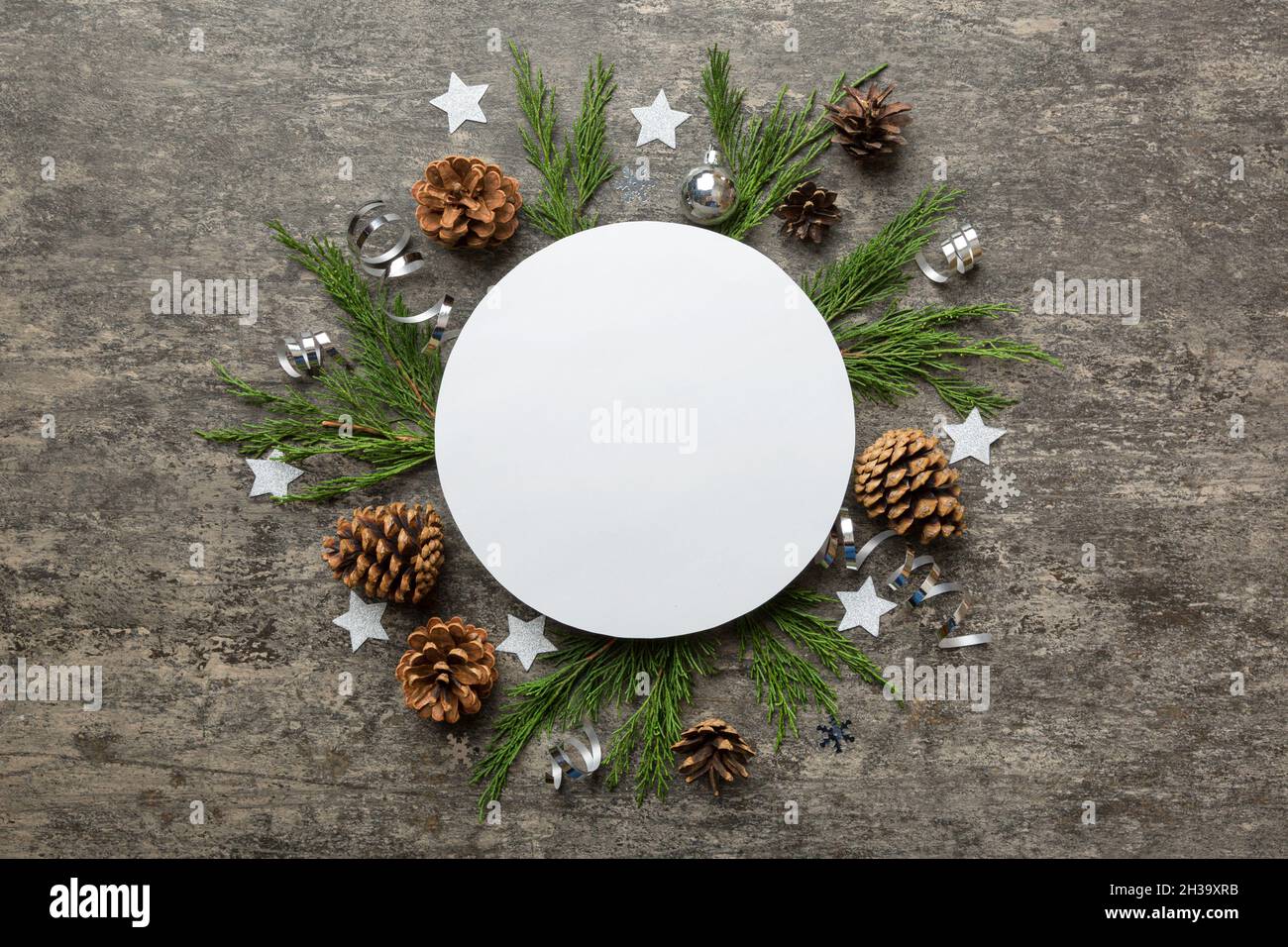 Flat lay Christmas composition. Round Paper blank, pine tree branches ...