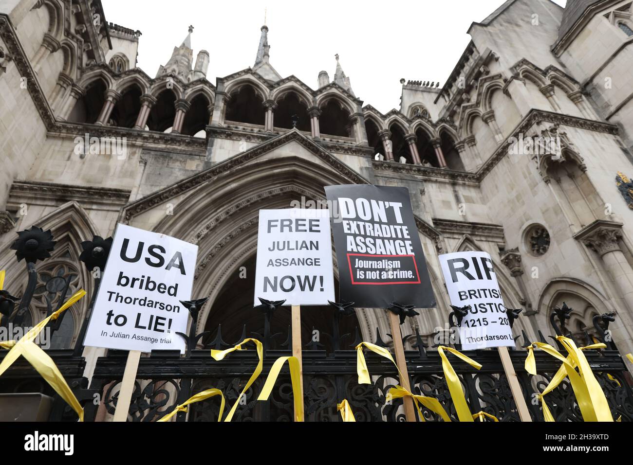Placards outside the High Court in London, ahead of a hearing for the ...