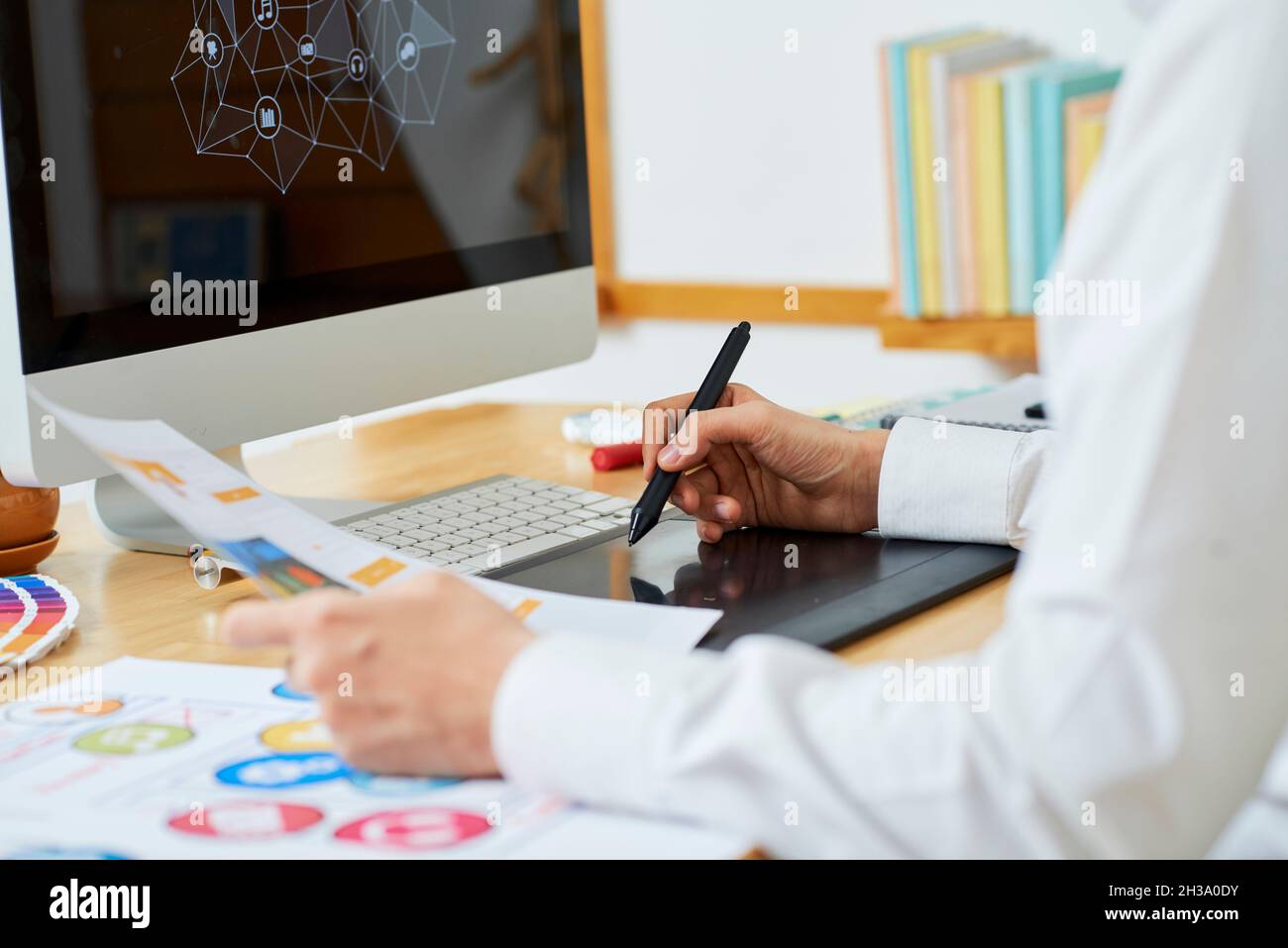 Close-up image of UI designer drawing with digital pen when creating ...