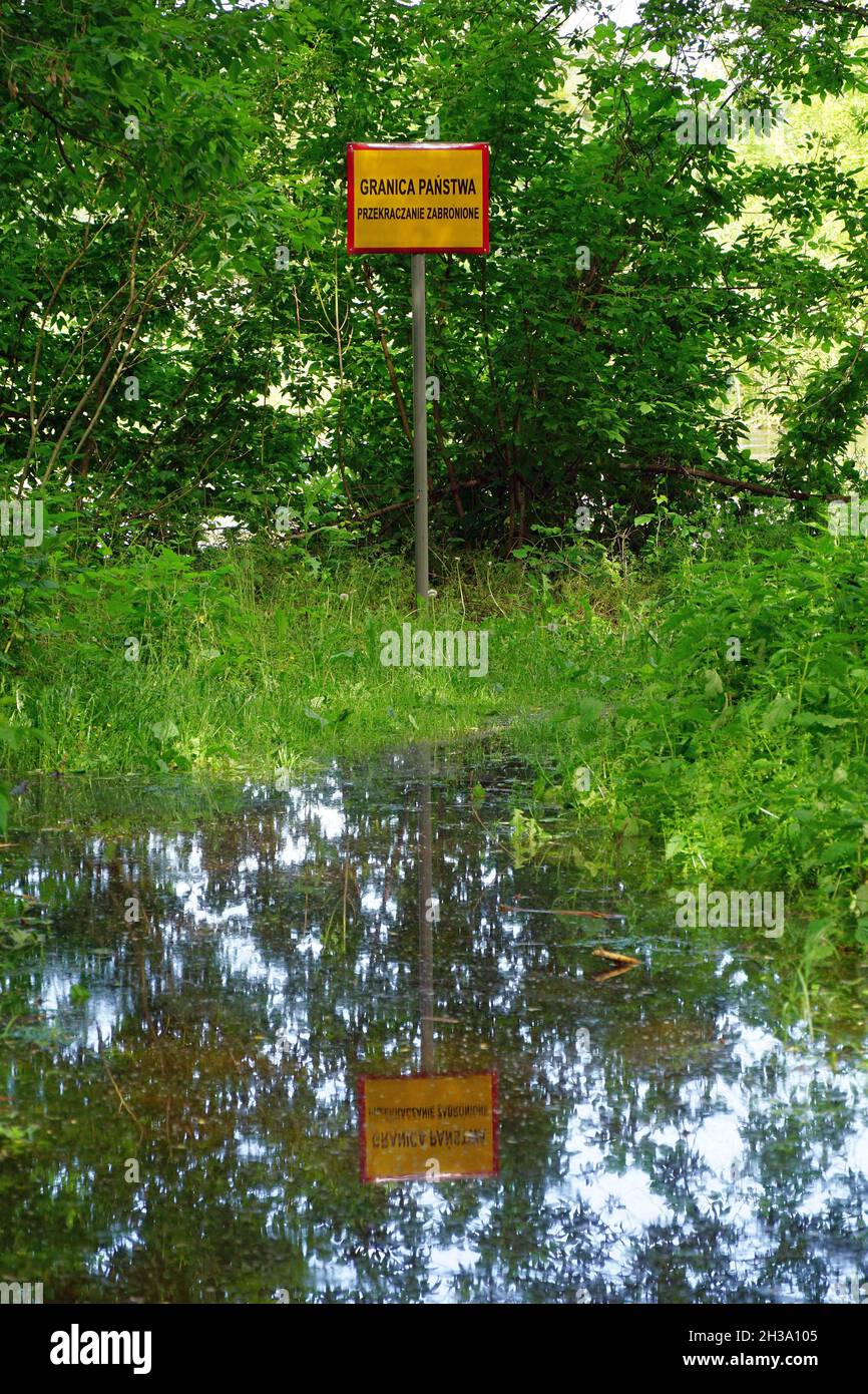 Border sign between Poland and Ukraine at Bug River. Bug river is the ...