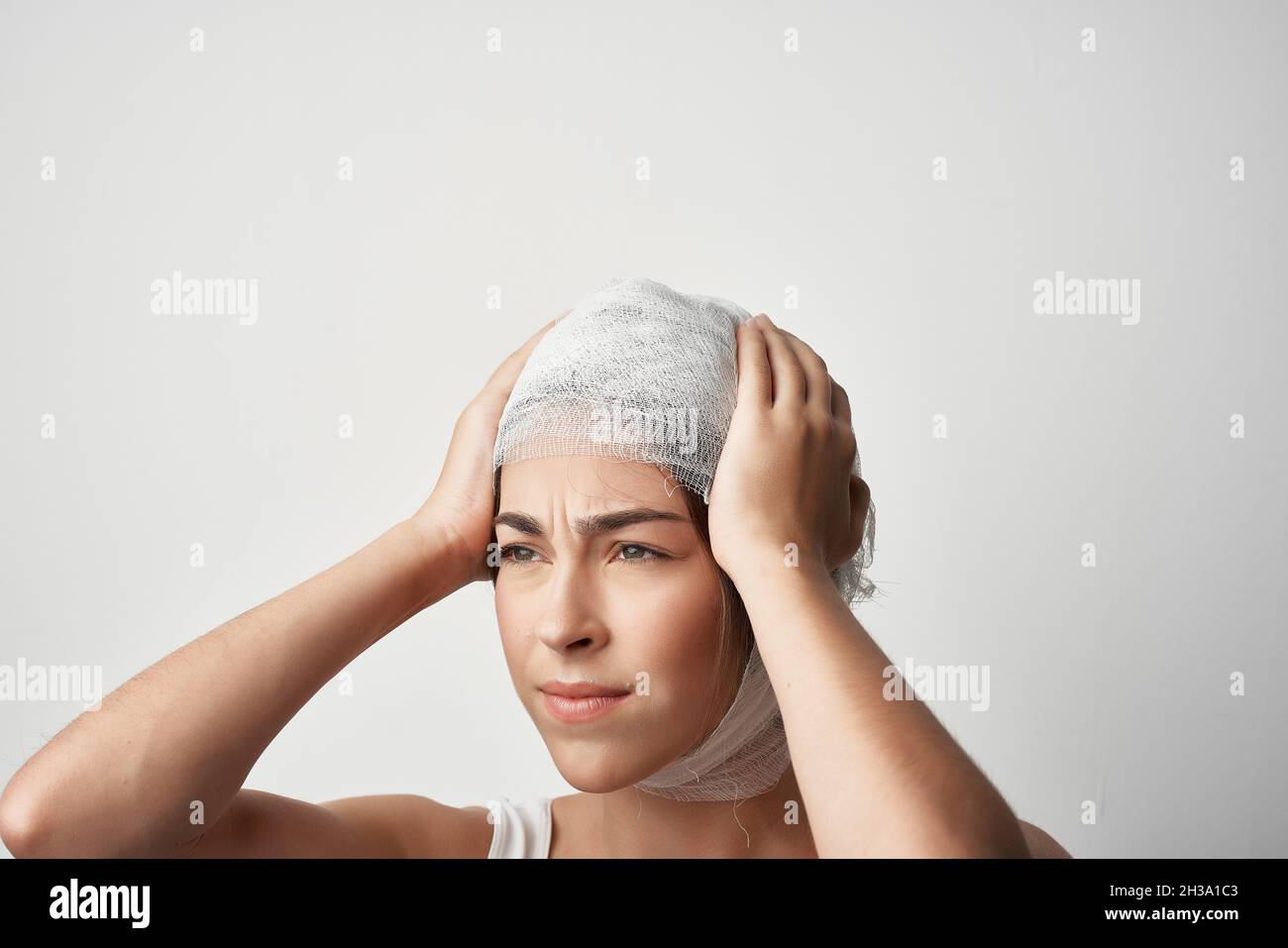 bandaged head injury treatment medicine Stock Photo - Alamy