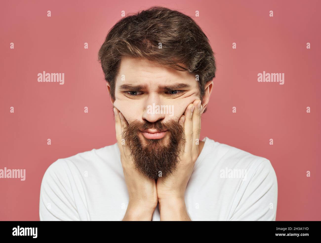 emotional man in a white t-shirt irritated facial expression Lifestyle ...