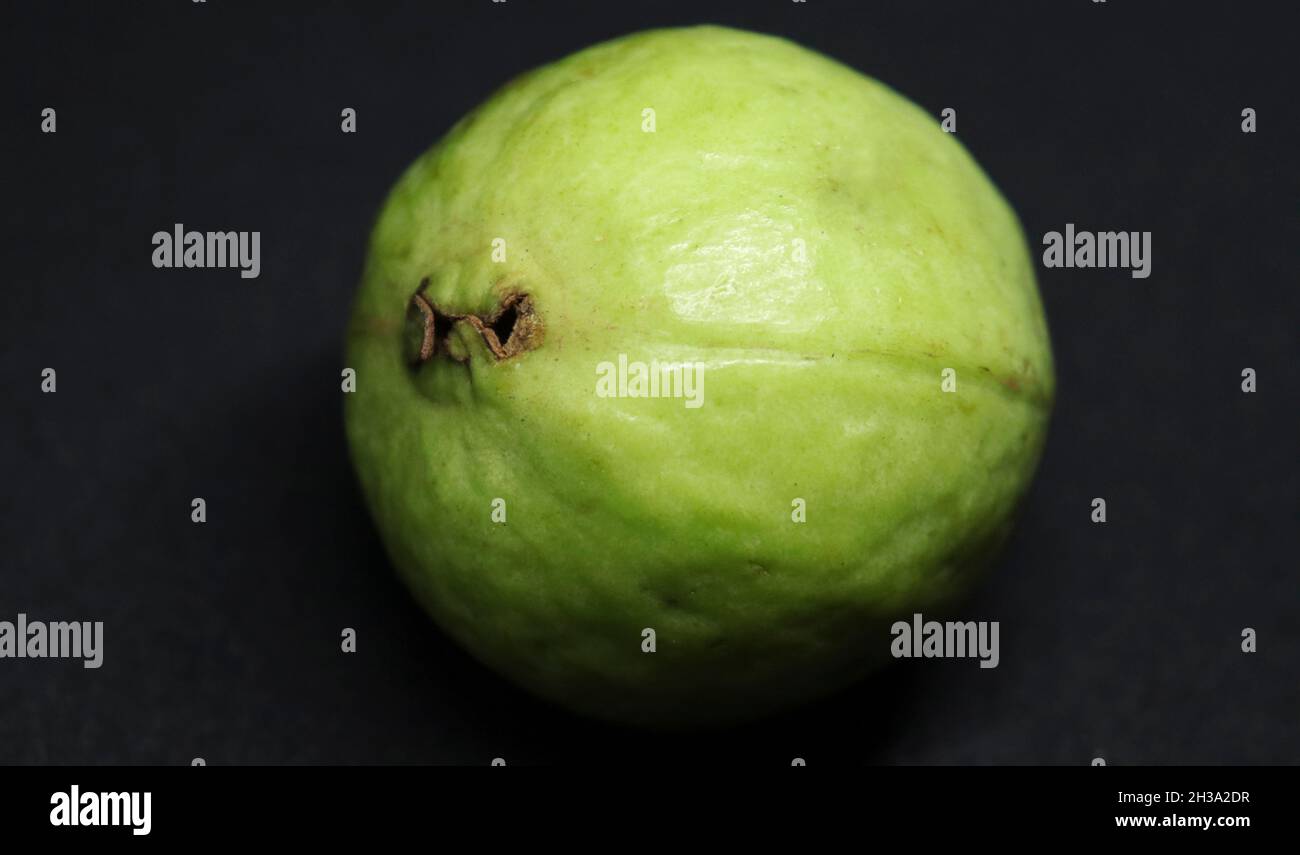 Green Guava (or) koyaka fruit is on a white background Stock Photo - Alamy
