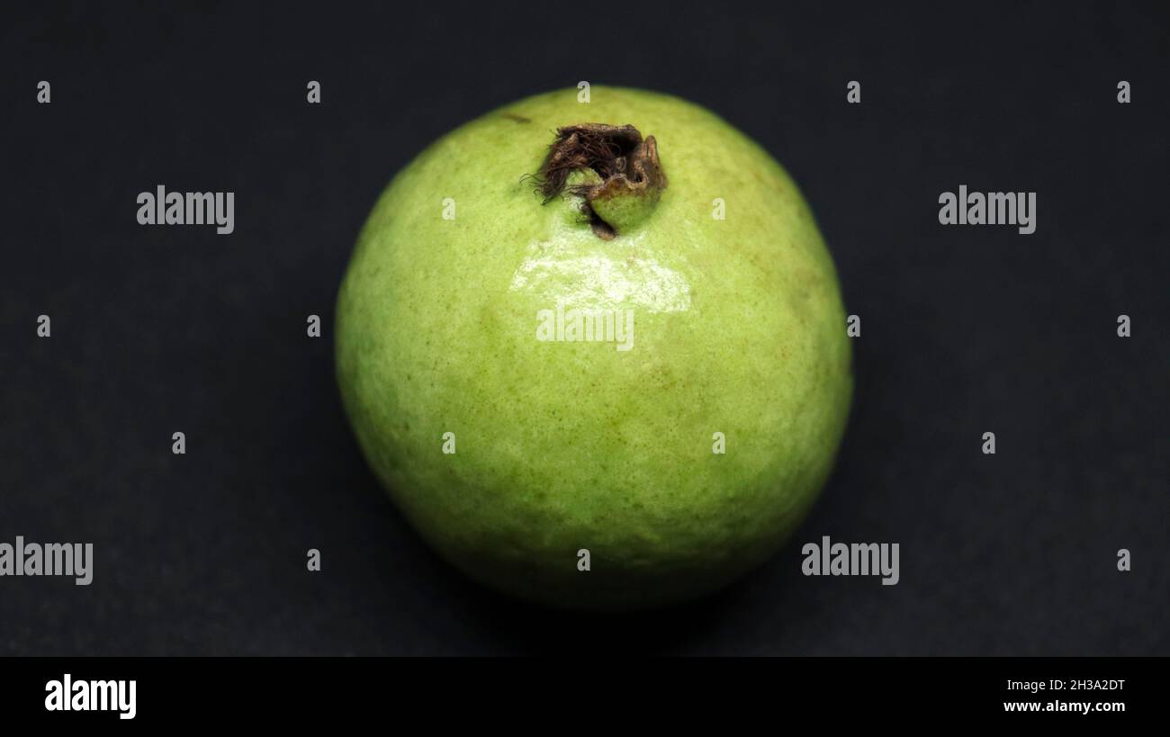 Green Guava (or) koyaka fruit is on a white background Stock Photo - Alamy