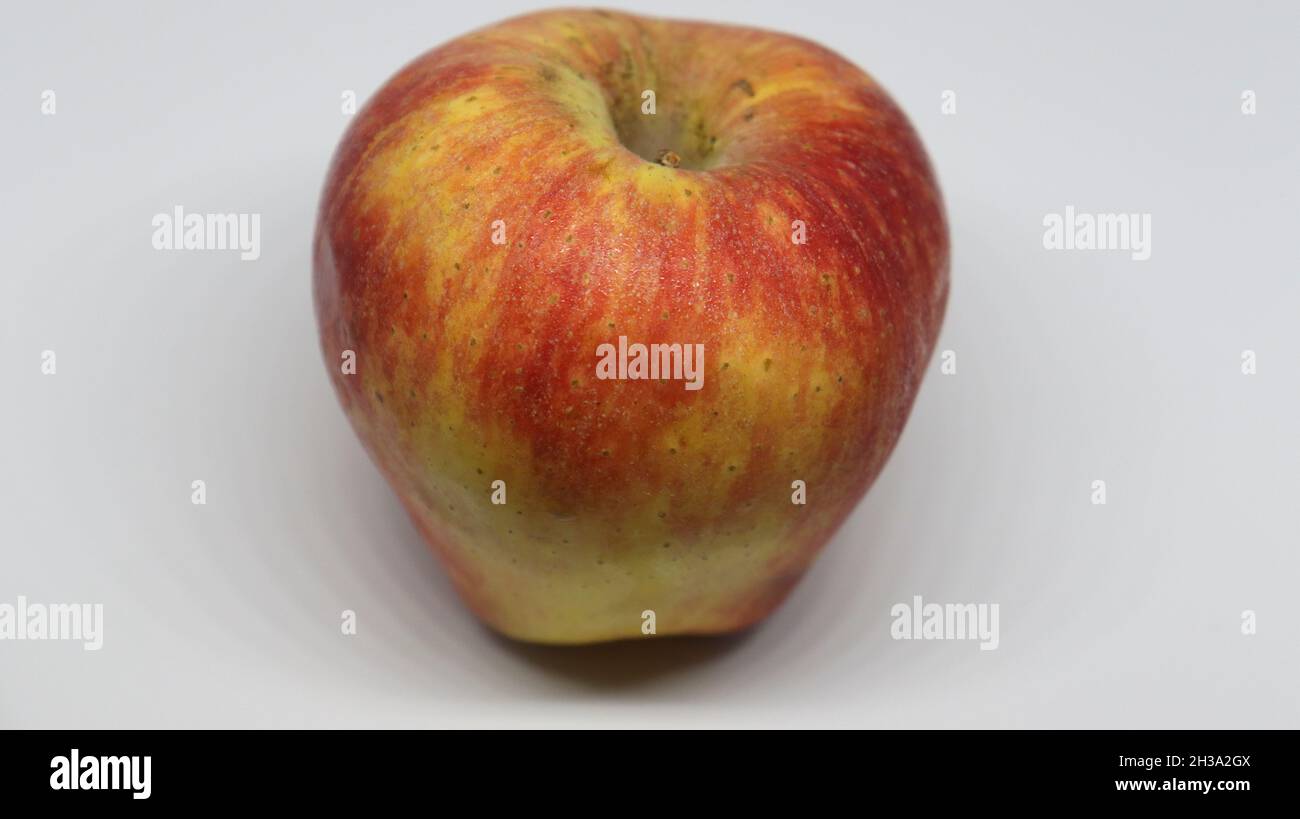 The light red apple is on a white background Stock Photo - Alamy