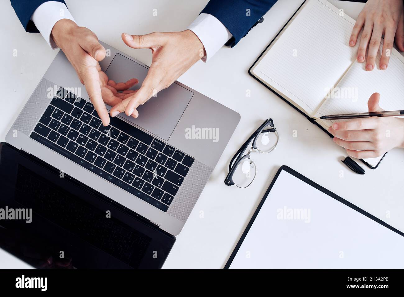 managers laptop and documents on the table technology Stock Photo - Alamy