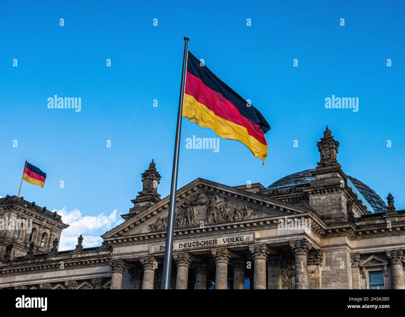 Berlin, Mitte. Reichstag Building with German flags German Parliament ...