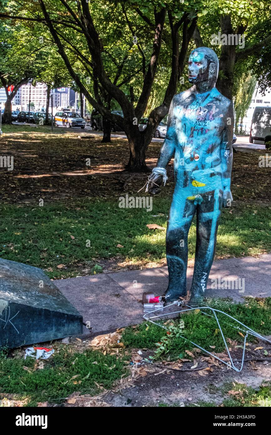 Standing figure in front of relief bodies. Sculpture by Andreas ...