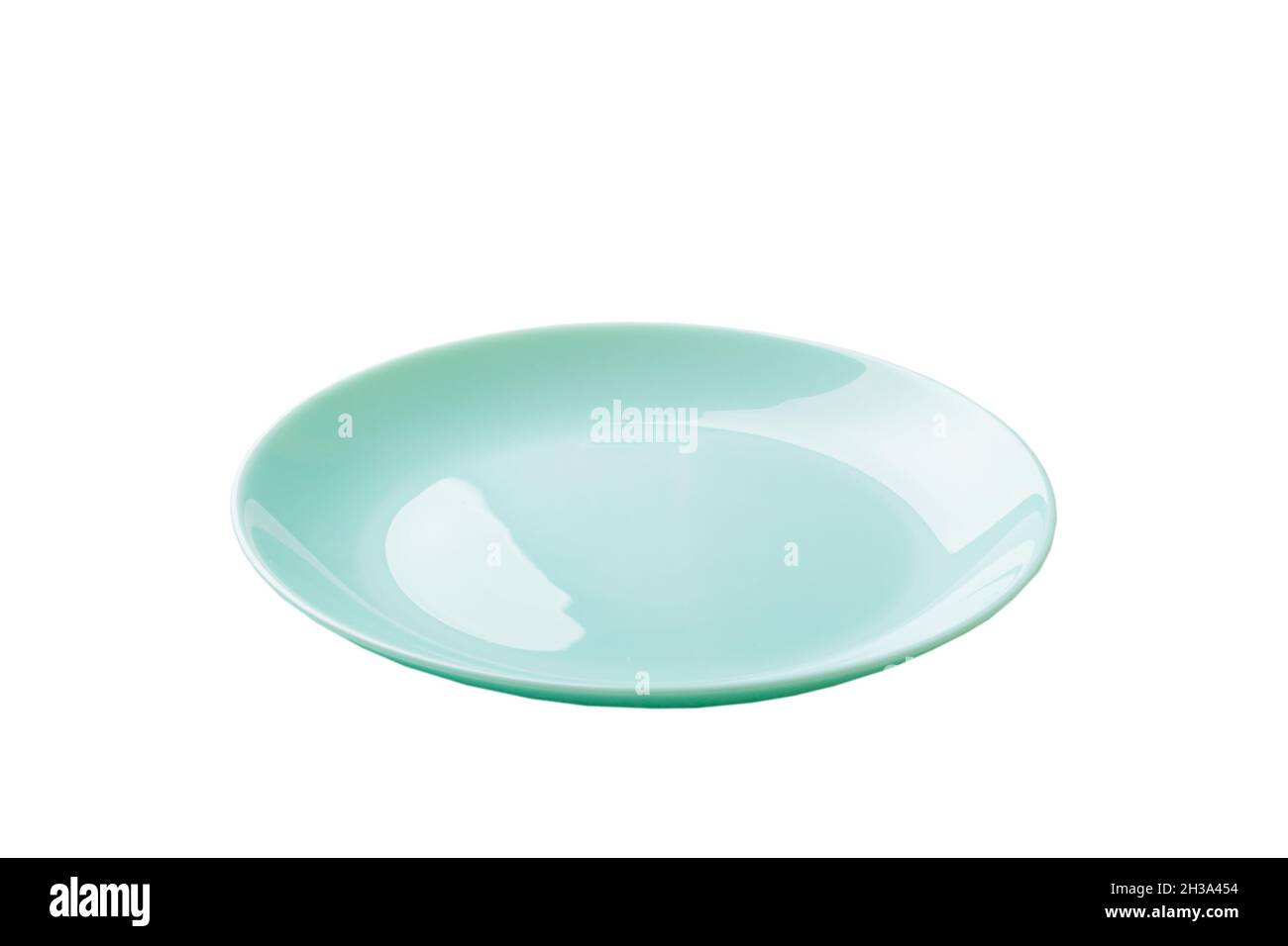 Blue ceramic round plate isolated over white background. perspective ...