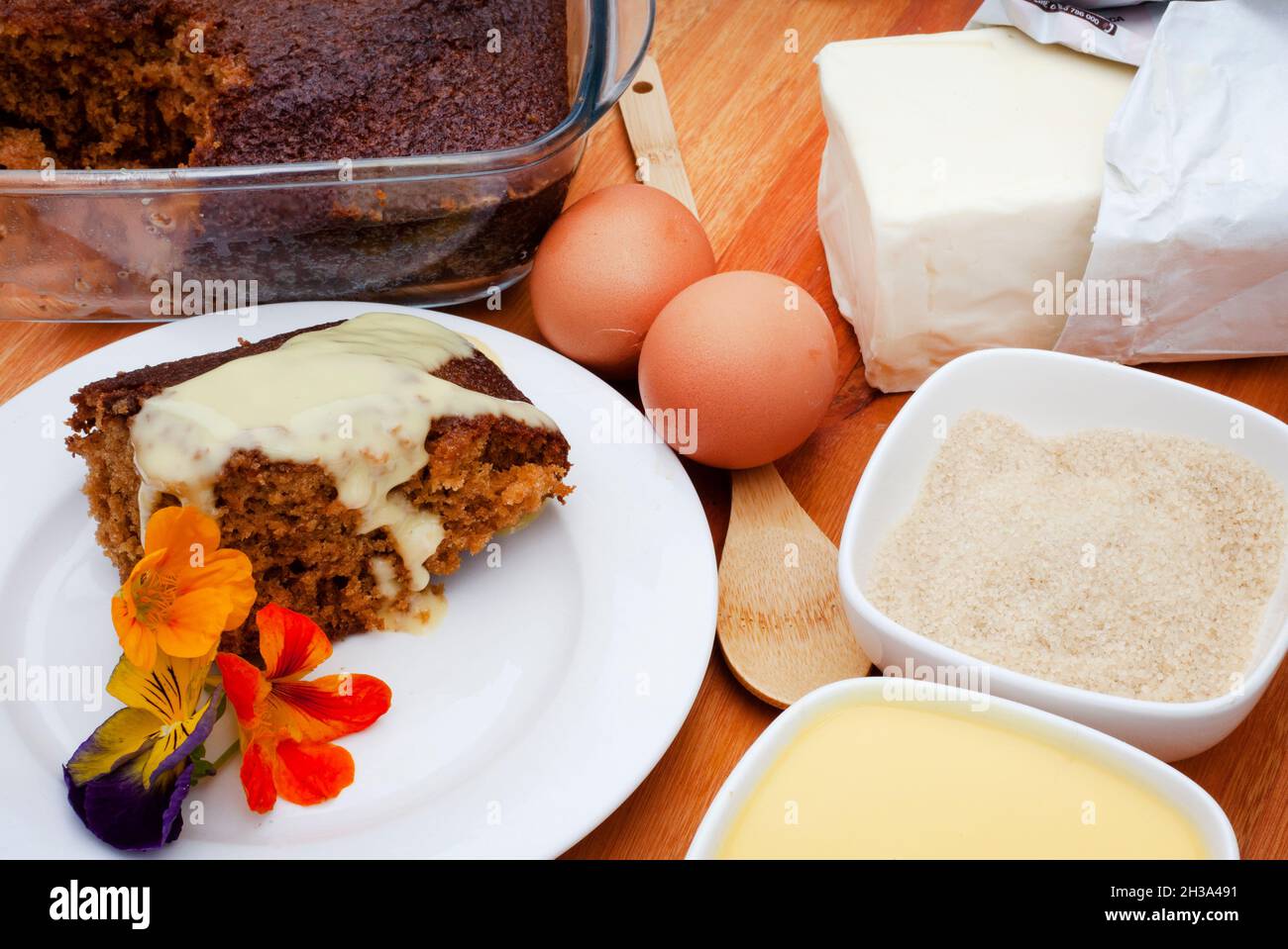 Traditional South African Malva pudding in rustic table setting Stock ...