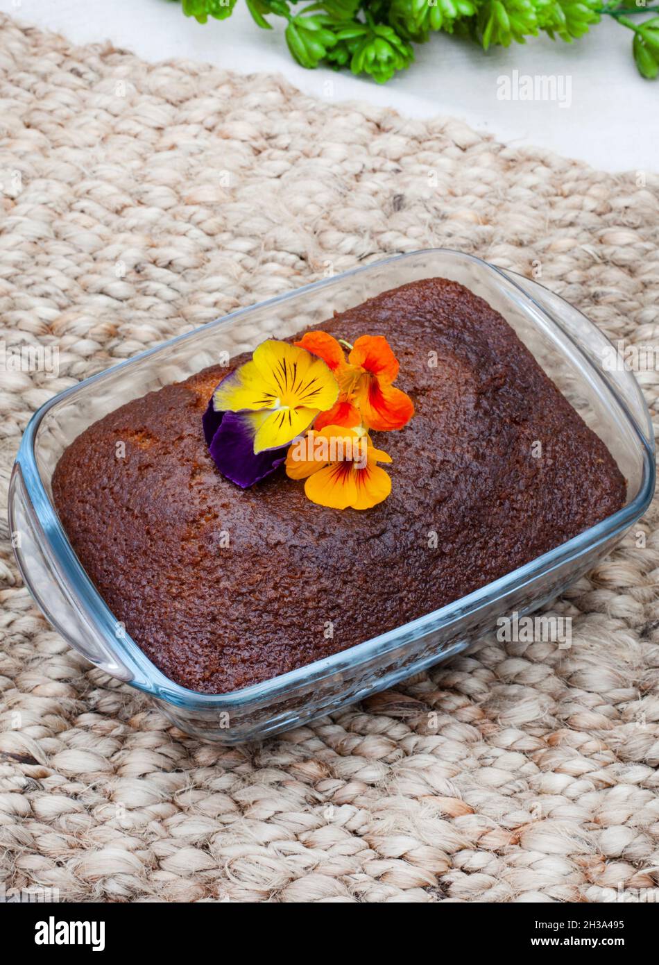 Traditional South African Malva pudding in rustic table setting Stock ...
