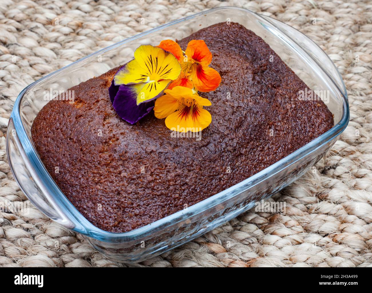 Traditional South African Malva pudding in rustic table setting Stock ...