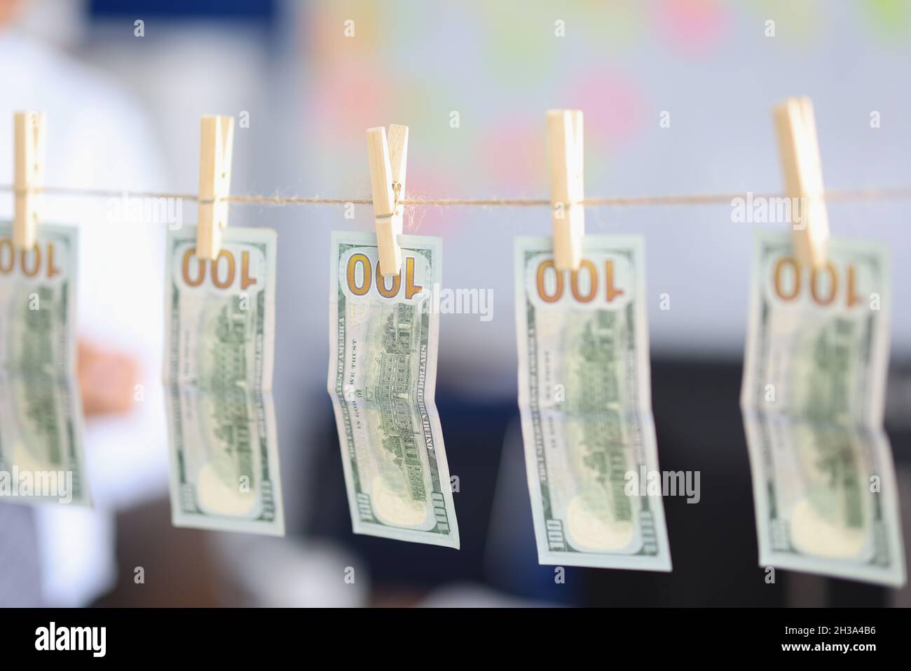 Green banknotes attached with clothespin Stock Photo - Alamy