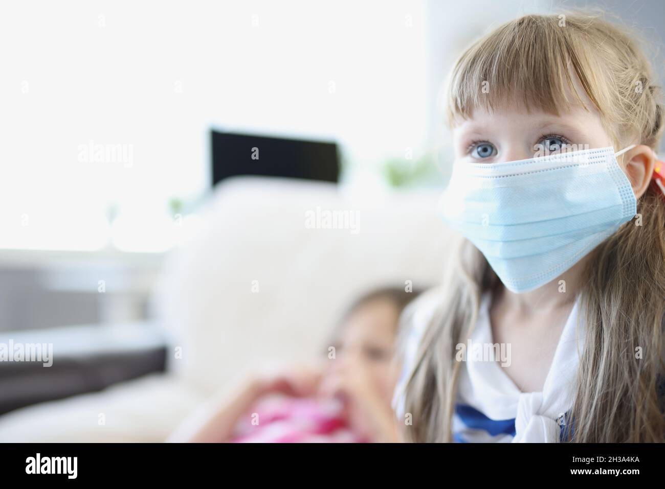 Child on self isolation with sister Stock Photo - Alamy