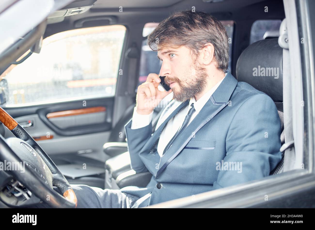 emotional man Driving a car trip luxury lifestyle self confidence Stock ...