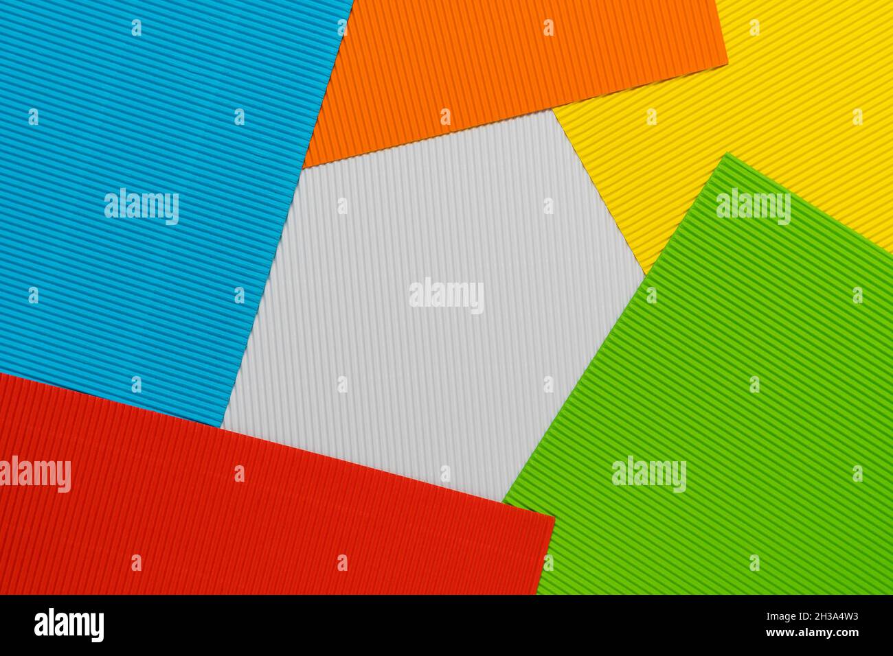 Striped colored embossed paper sheets with copy space. Colorful paper ...