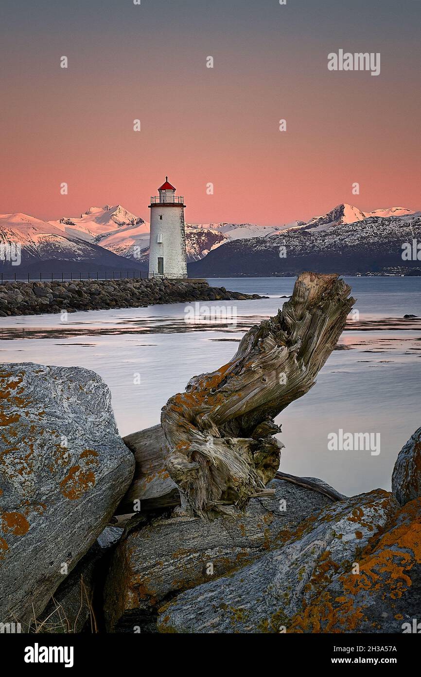 The old log and the lighthouse, Godøy, Norway Stock Photo - Alamy