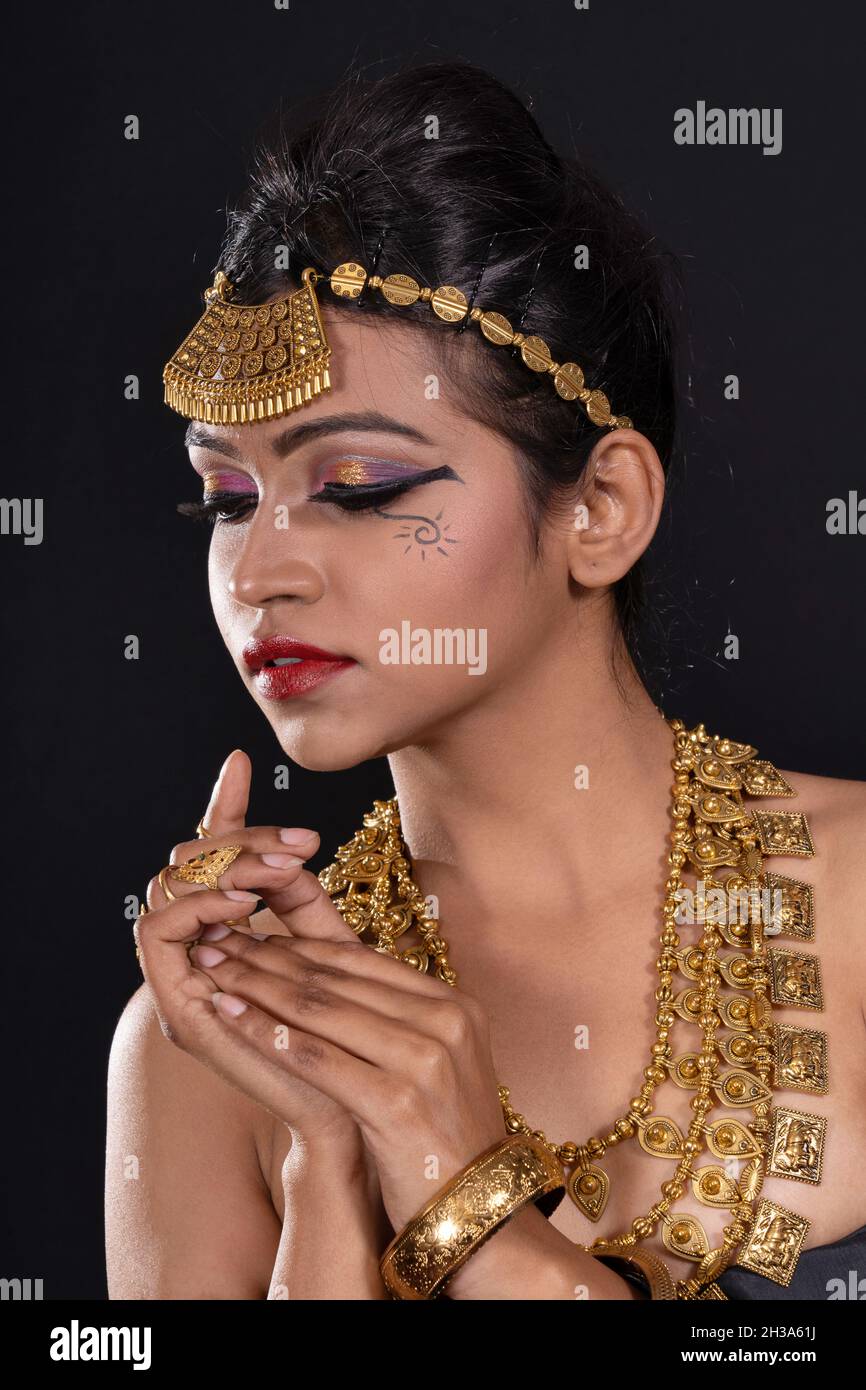 Woman in Tribal attire look. Black background Stock Photo - Alamy