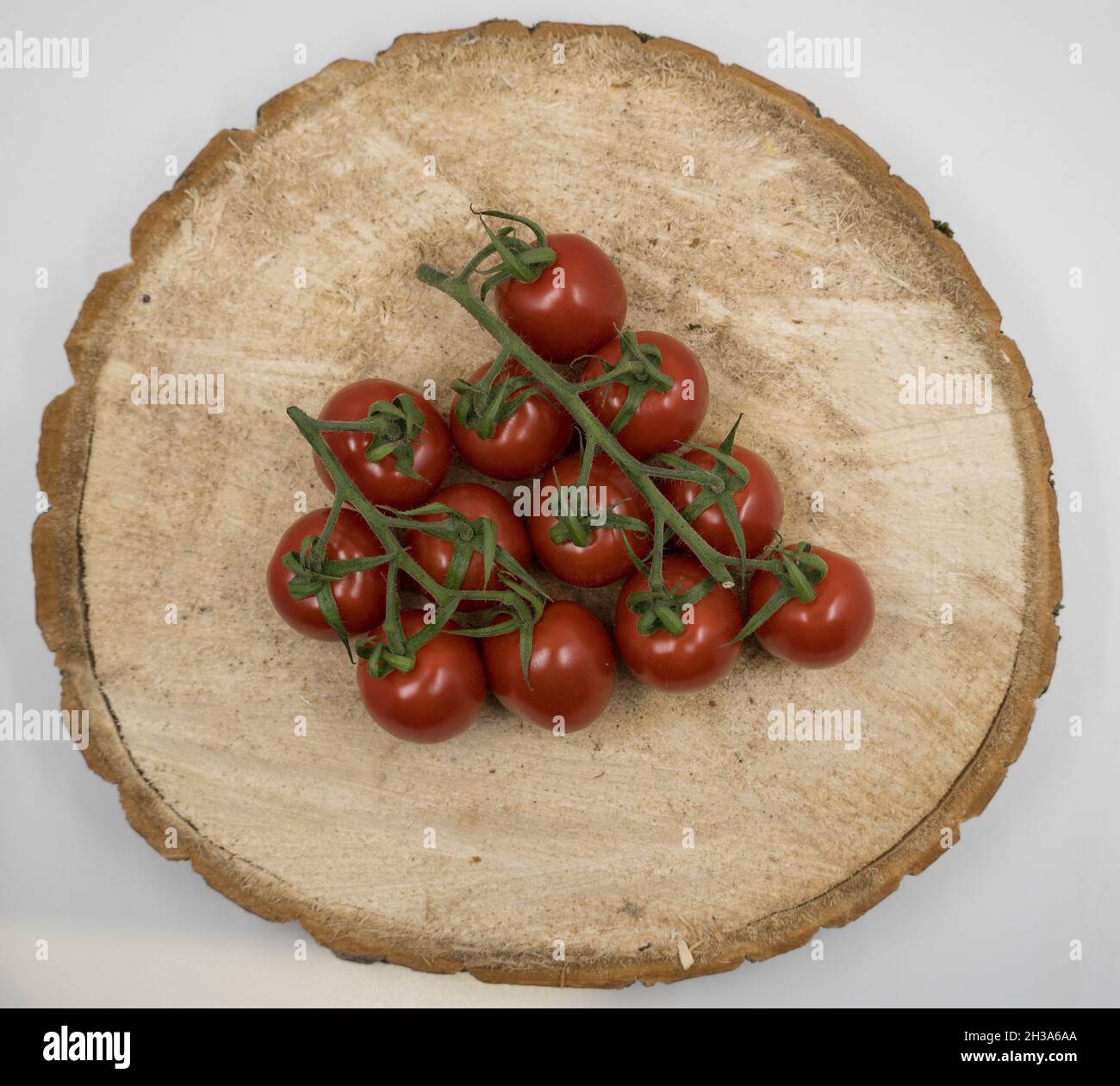 wooden background with vine tomatoes. View from above Stock Photo - Alamy