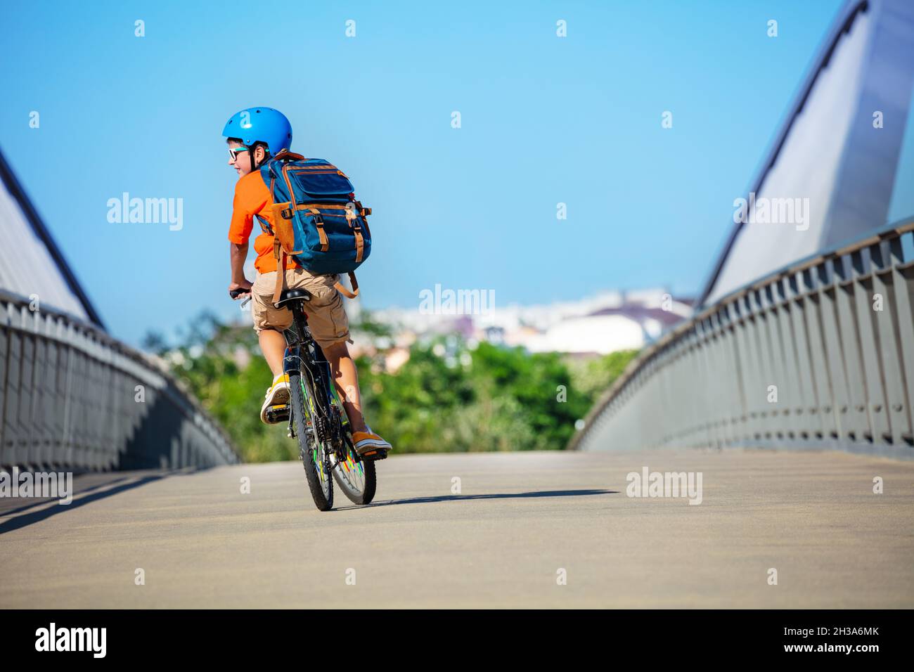 Back view boy on bicycle hi-res stock photography and images - Alamy