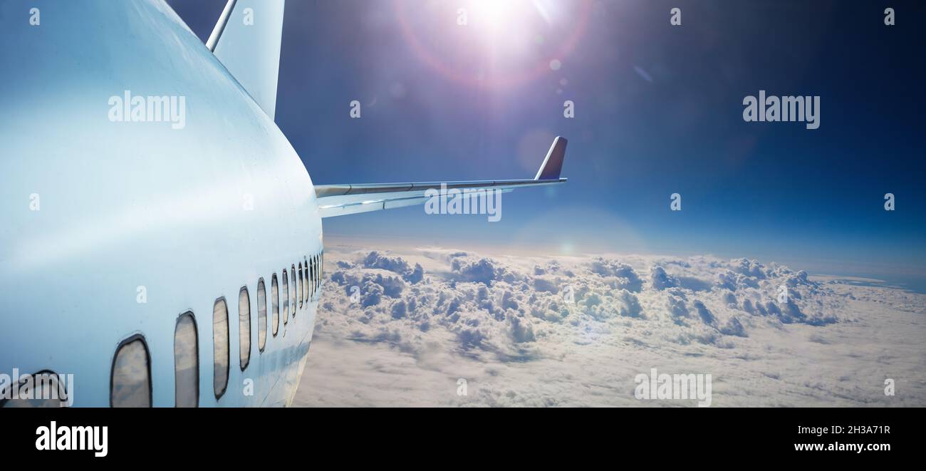 View on the airplane tail from wing in sky concept Stock Photo - Alamy