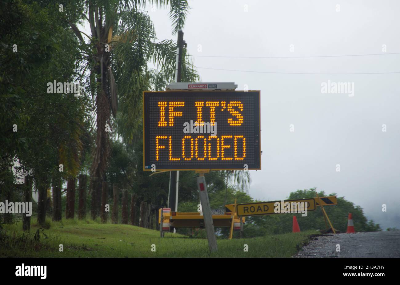 Illuminated roadside flood-warning in Queensland, Australia. Three ...
