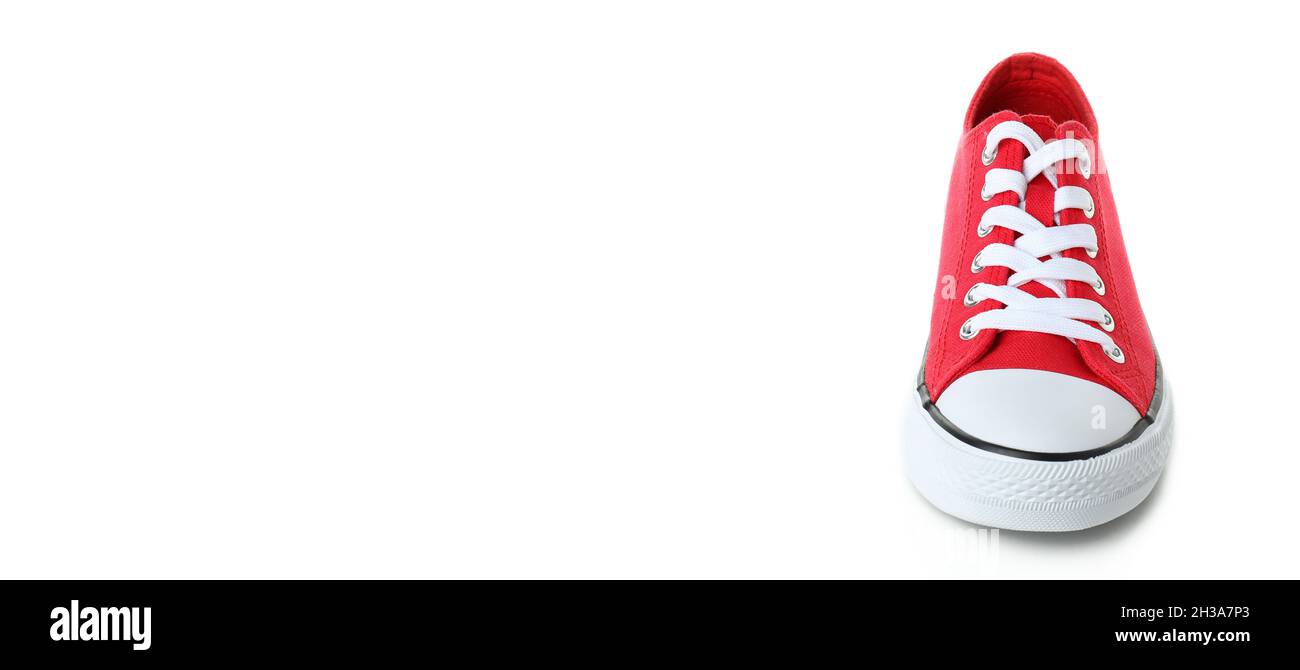 One red sneaker isolated on white background Stock Photo - Alamy