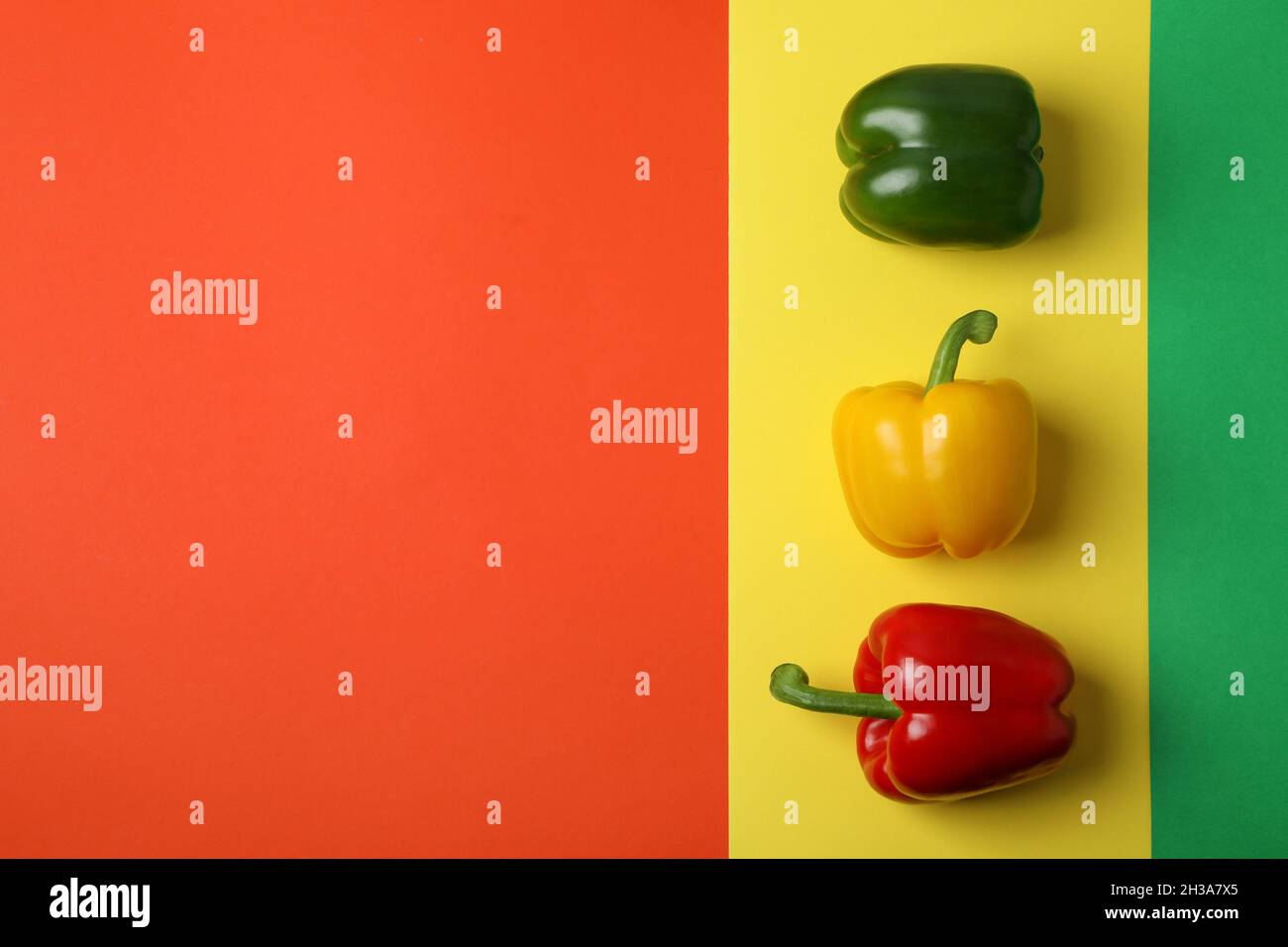 Multi-colored bell pepper on multicolored background Stock Photo - Alamy