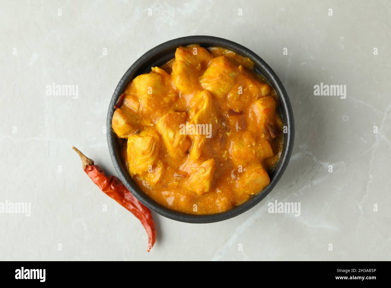 Chicken tikka with ingredients on light textured background Stock Photo ...