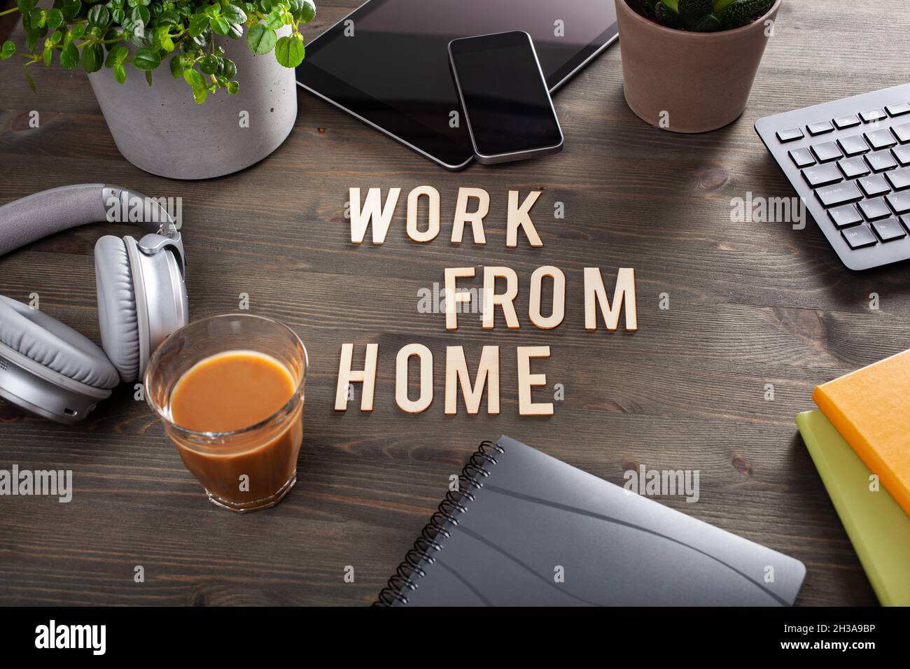 work from home text desk with keyboard computer smartphone notebook ...