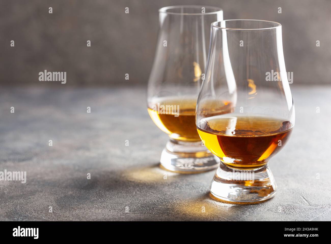 glass of whisky spirit brandy on gray concrete background Stock Photo ...