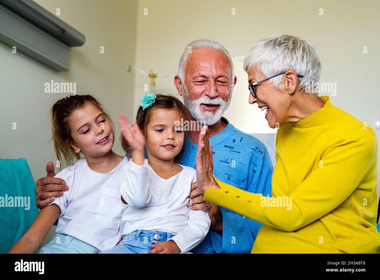 Child visit sick grandparent hi-res stock photography and images - Alamy
