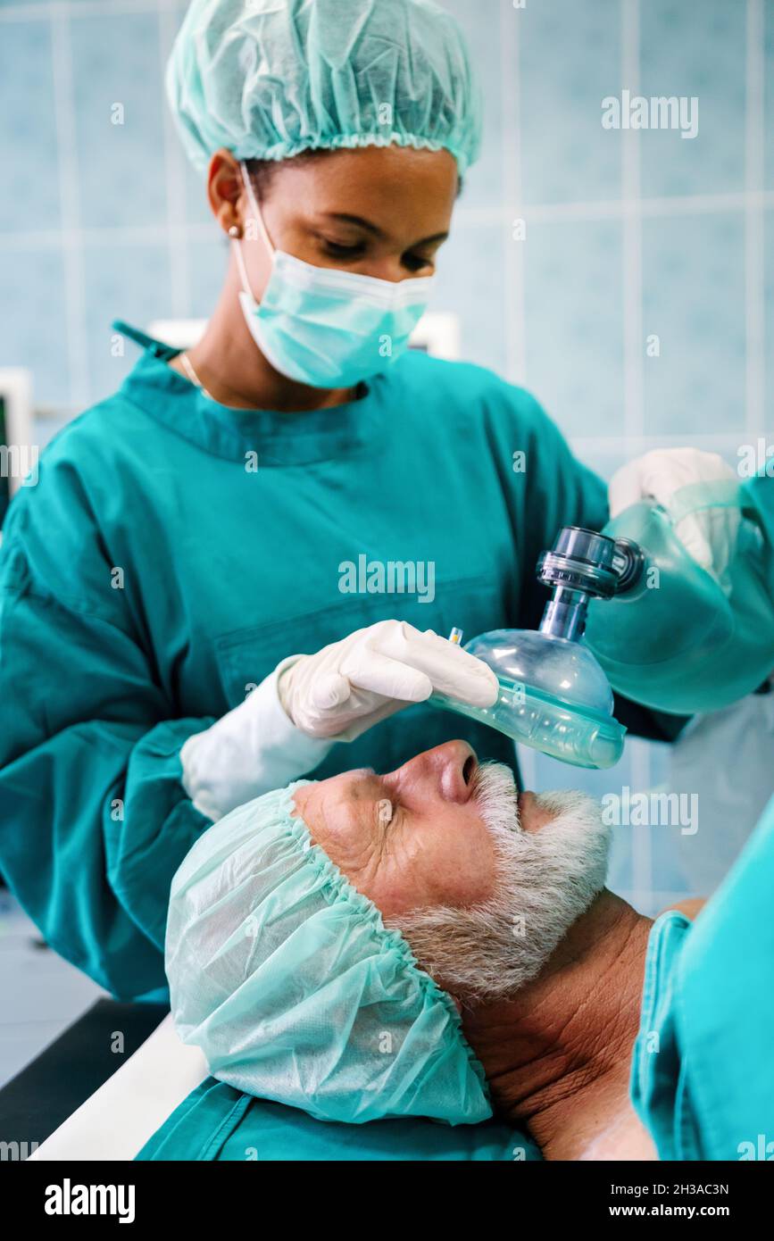 Anesthesiologist doctor anesthetized a surgical patient in hospital ...