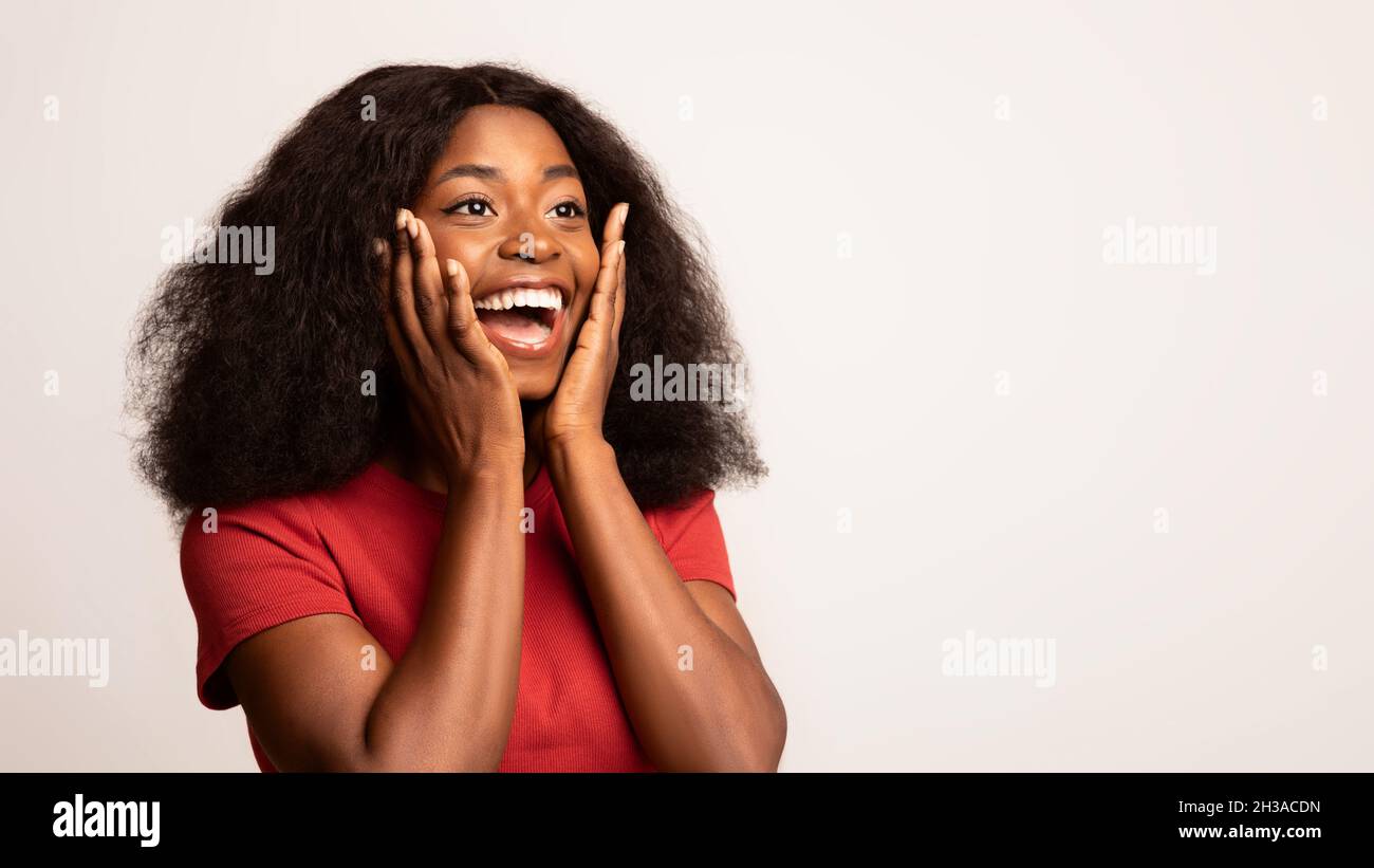 Amazing Offer. Portrait Of Surprised Black Lady Looking Away With ...