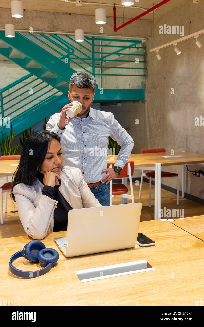 Coworkers having a work conversation while having coffee Stock Photo ...