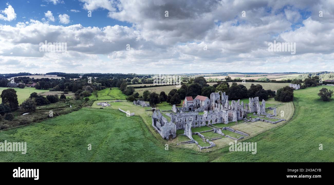 panoramic landscape image of the ruins of Castle Acre Priory a medieval ...