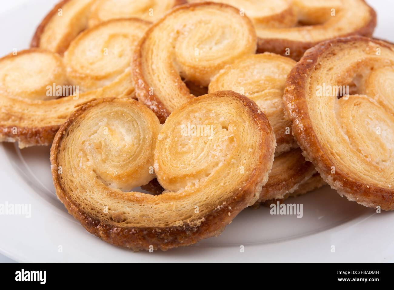 Palmier puff pastry isolated on white background Stock Photo - Alamy