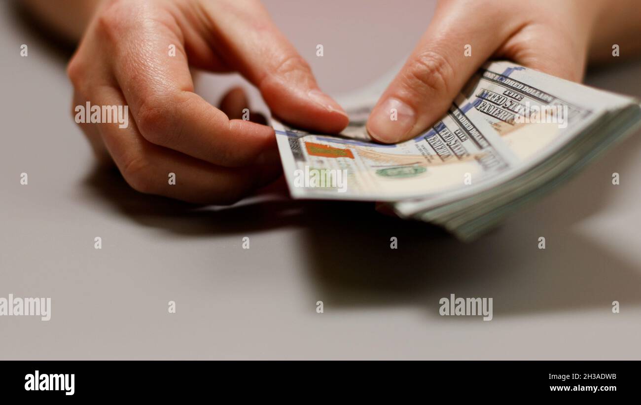 Woman hand count the united states currency. Economy concepts Stock ...