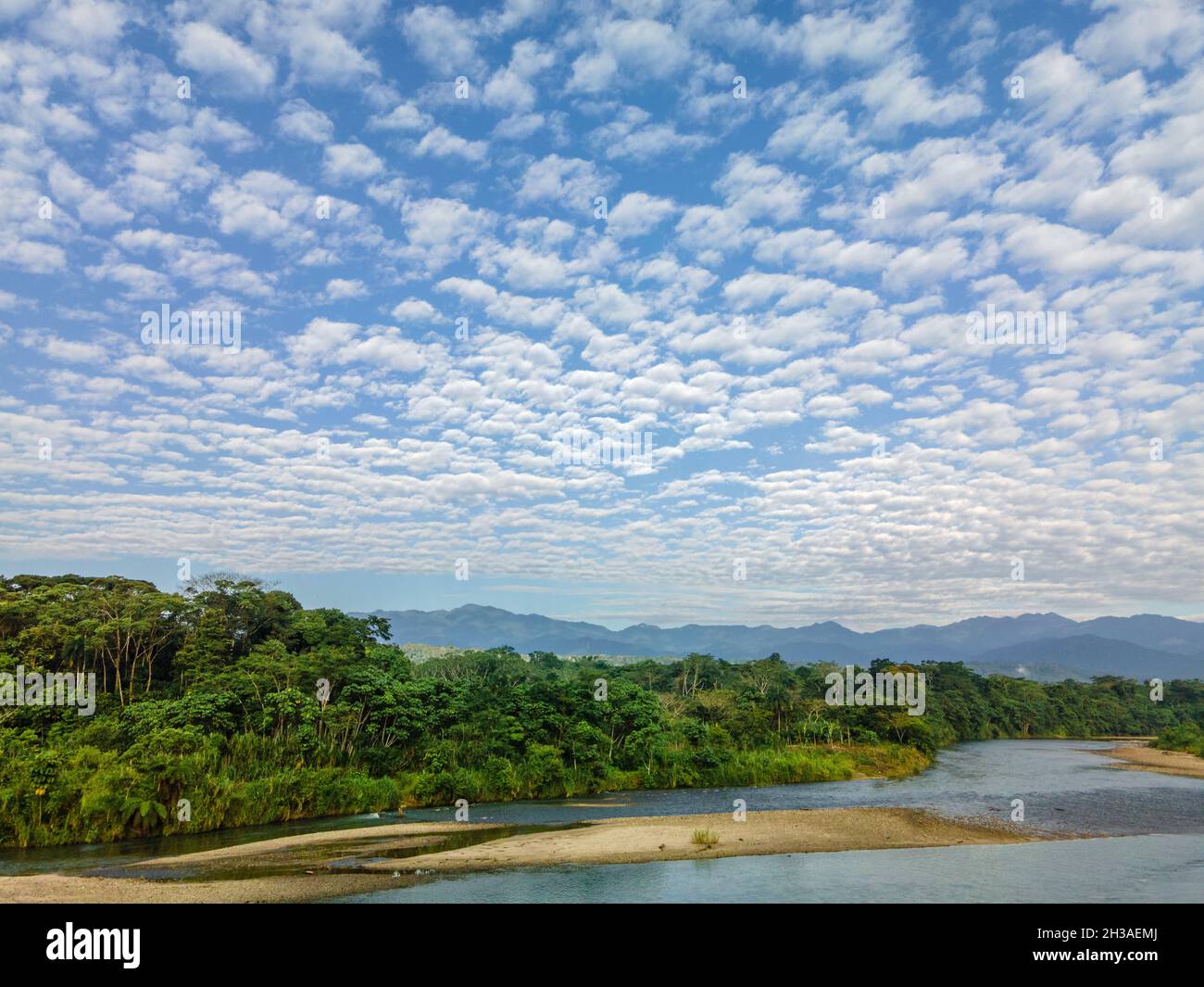 Aerial view of the cloudy sky over the Amazona rainforest in Tena ...