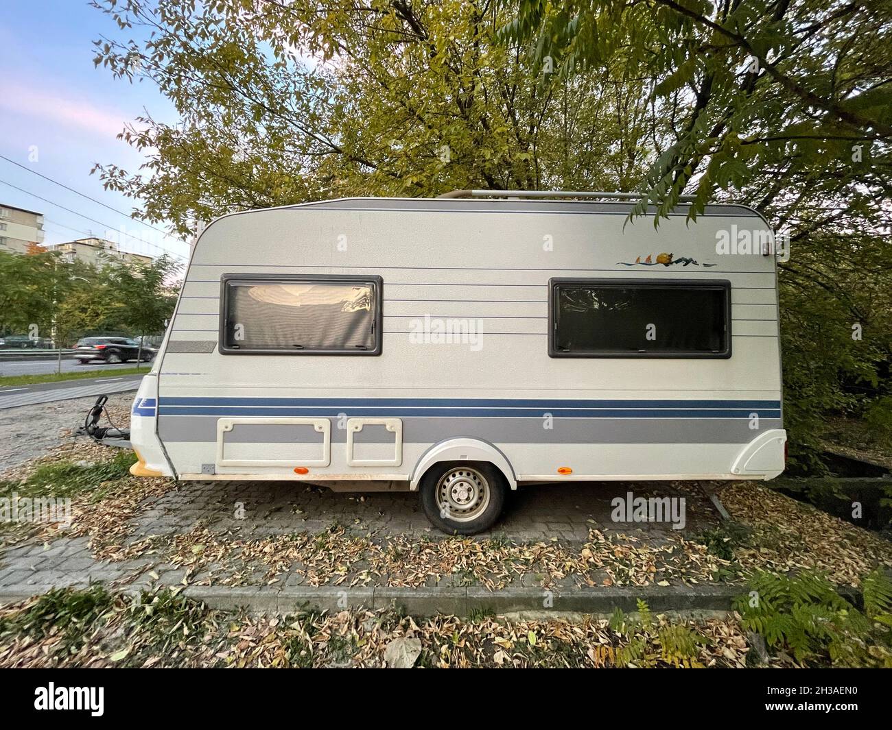 RV camping trailer parked in the city Stock Photo - Alamy